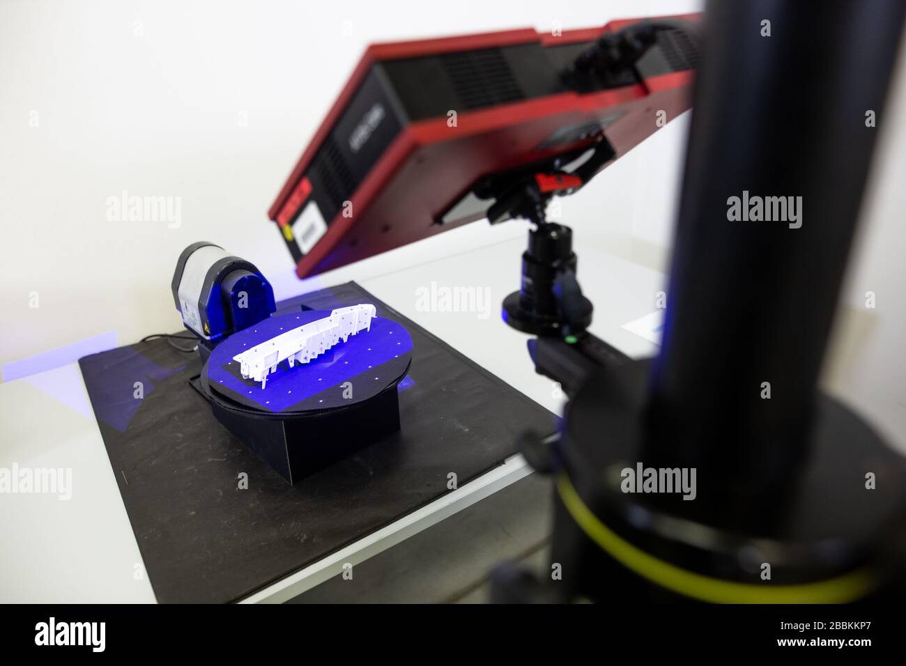 Professional 3D scanner scanning an industrial object, plastic molding ...