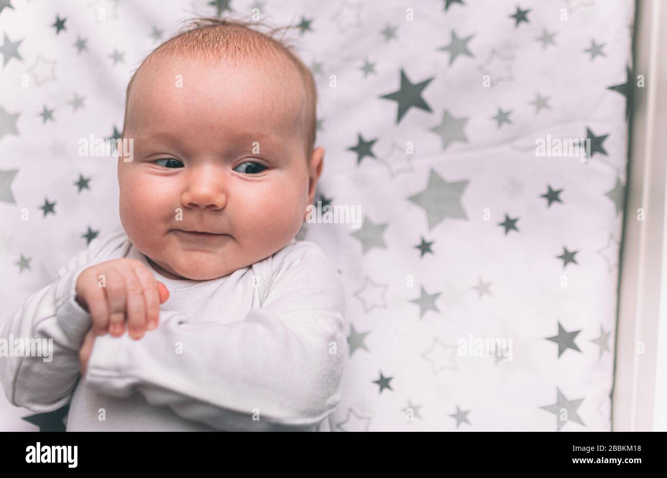 top view portrait of a baby on a changing table. Newborn child on the ...