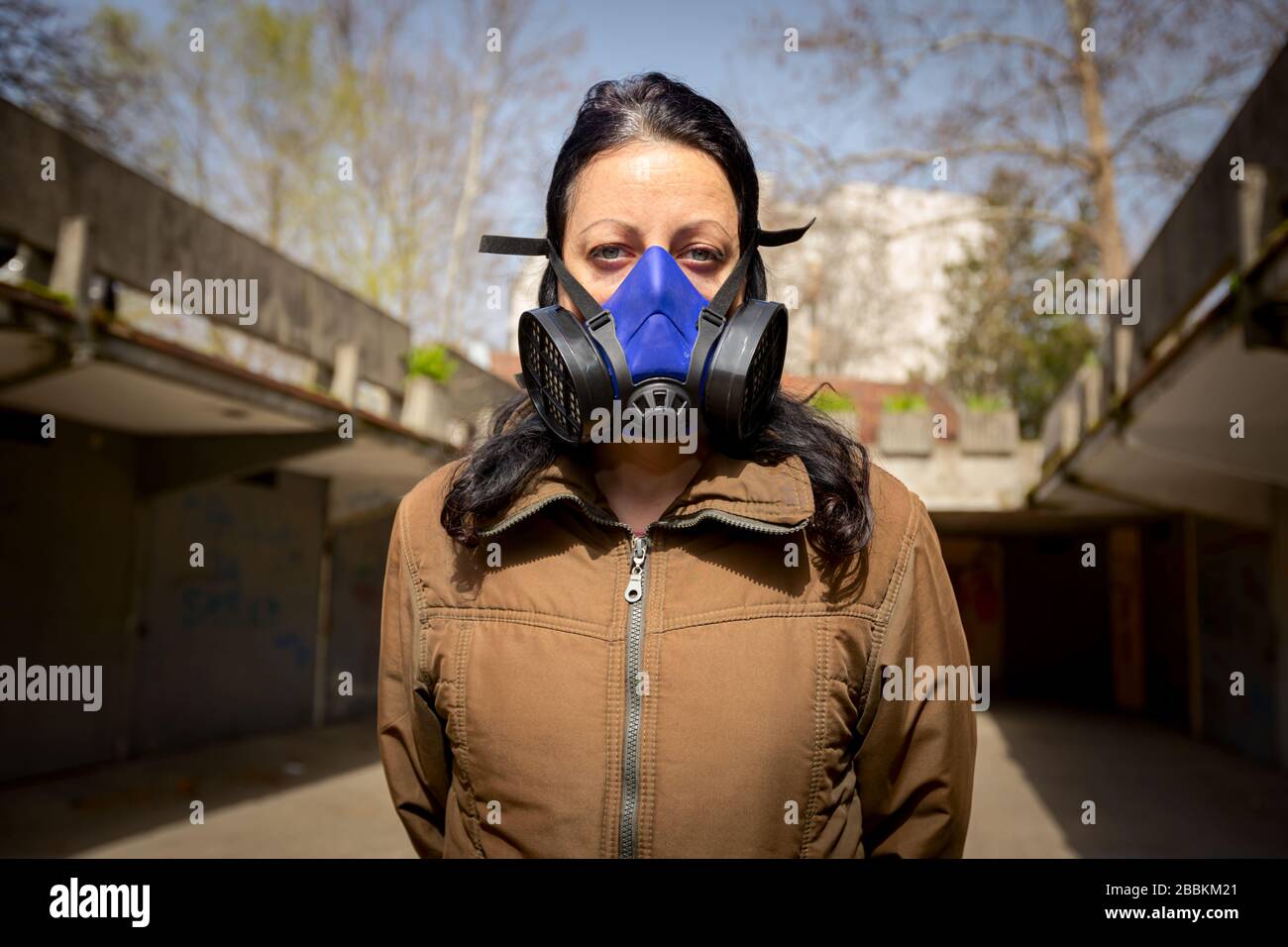 Woman is wearing industrial mask with paper filter her face for ...