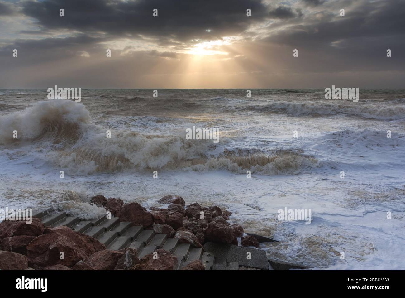 Storm at sea. Huge wave. Waves break on the shore. Sea view at sunset ...