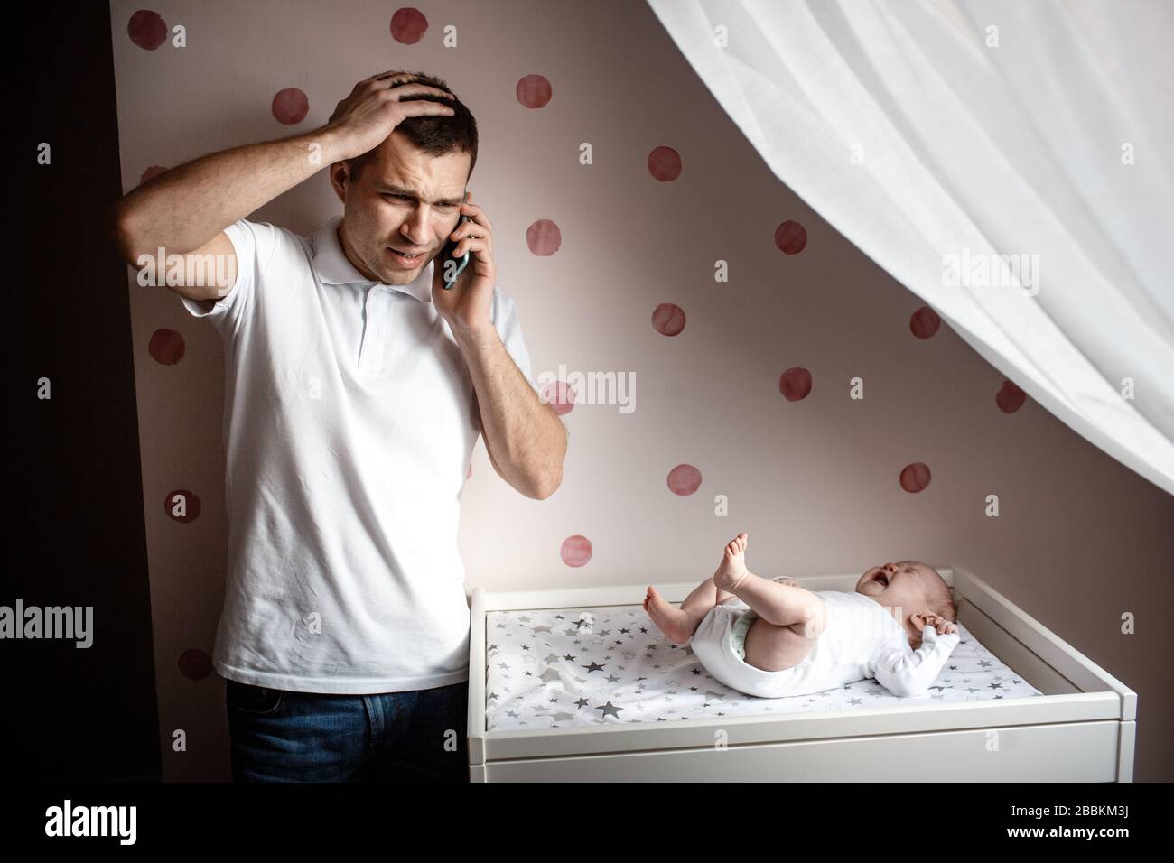 Father and little kid in the nursery. The first year of life ...