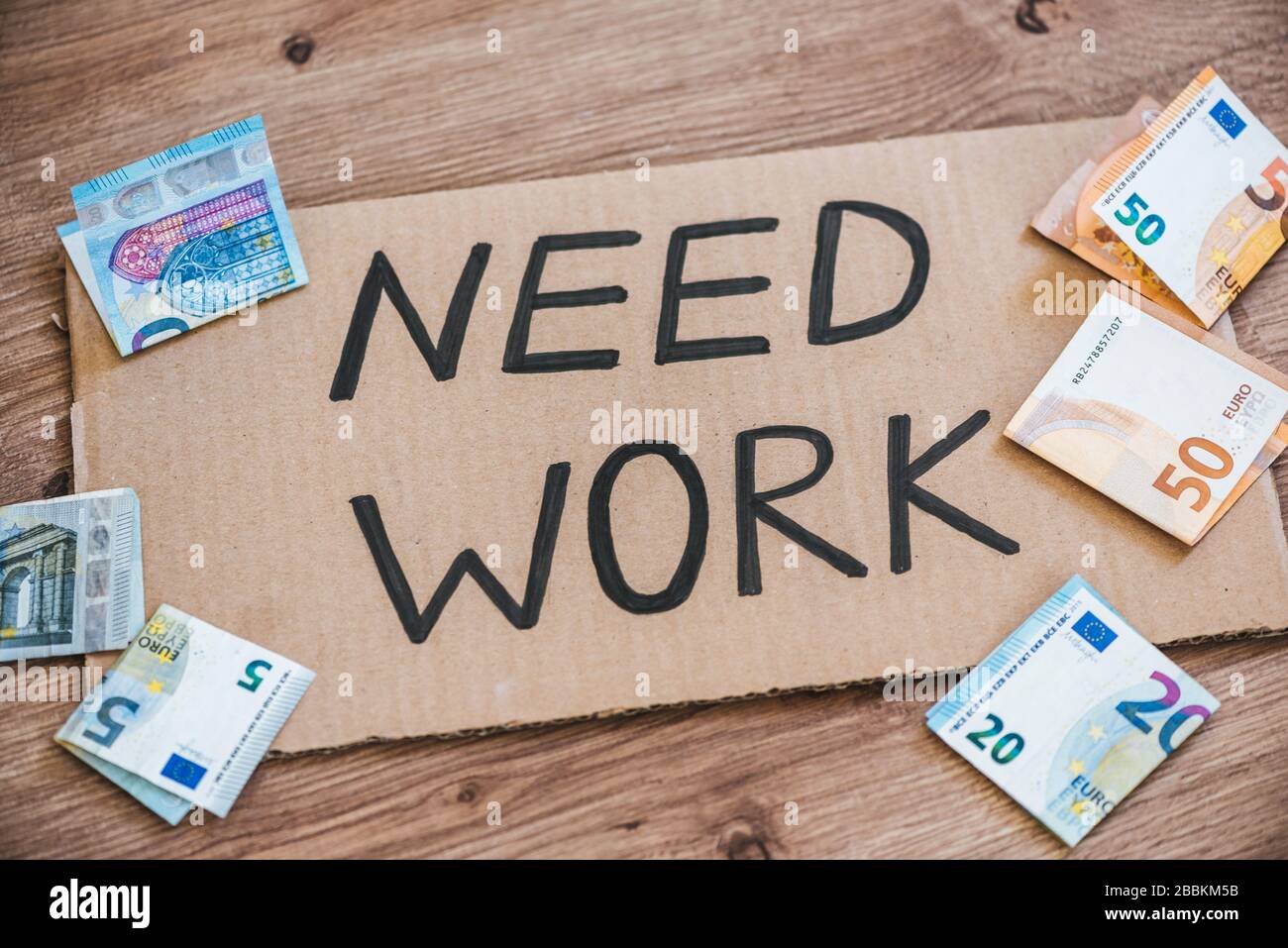 "Need work"sign and euros. Economic crisis / unenmployment concept ...