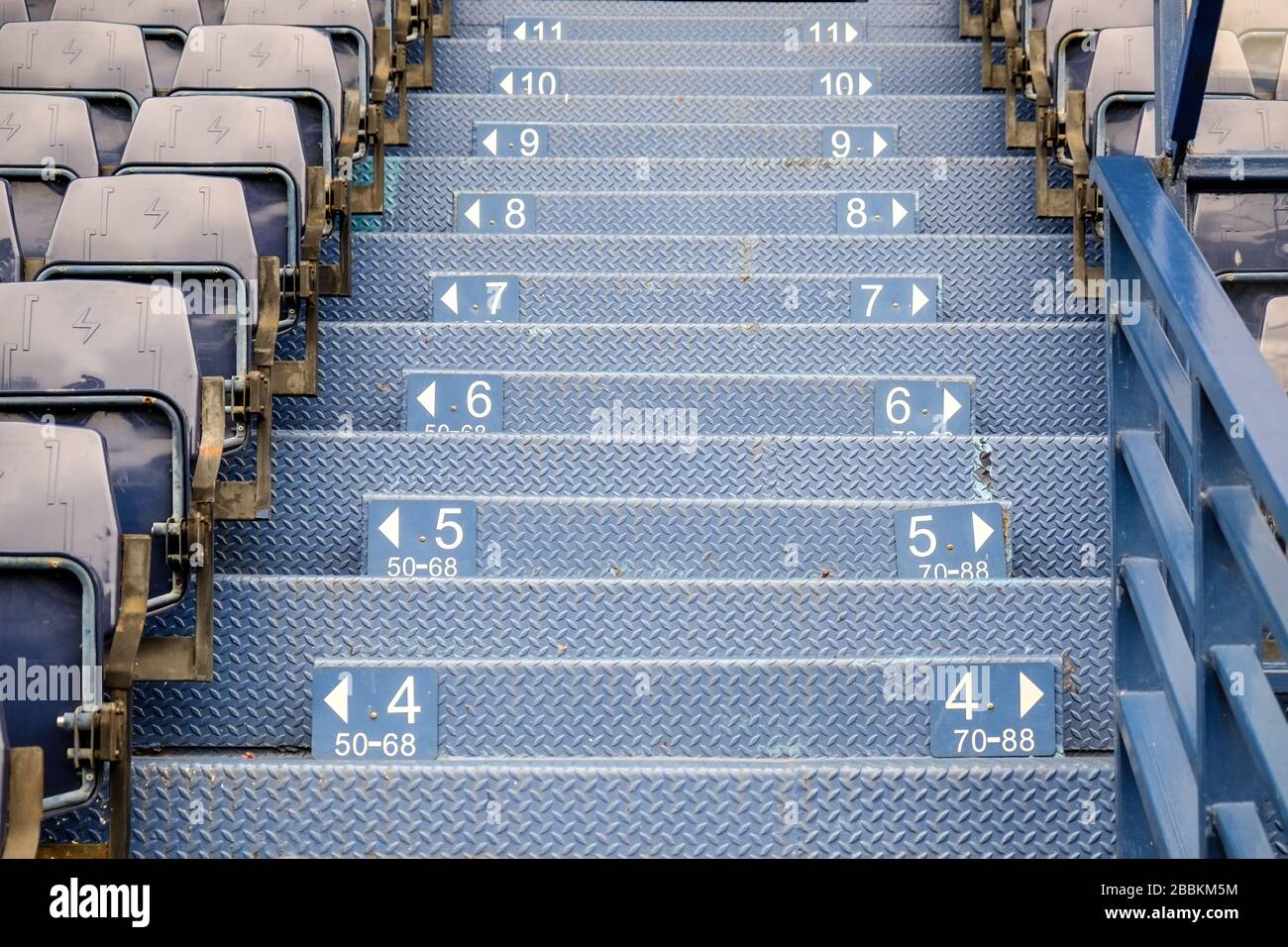 Navy blue amphitheater in football arena Stock Photo - Alamy