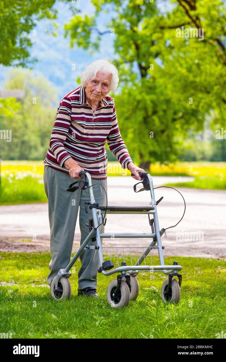 Senior citizen with walker goes for a walk, Austria Stock Photo - Alamy