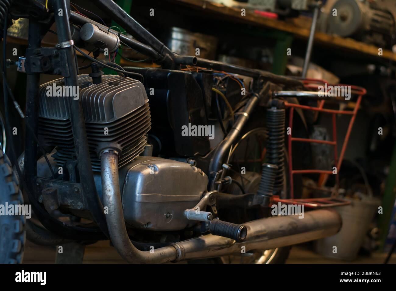 Old motorcycle, which needs to be repaired, in the workshop Stock Photo ...