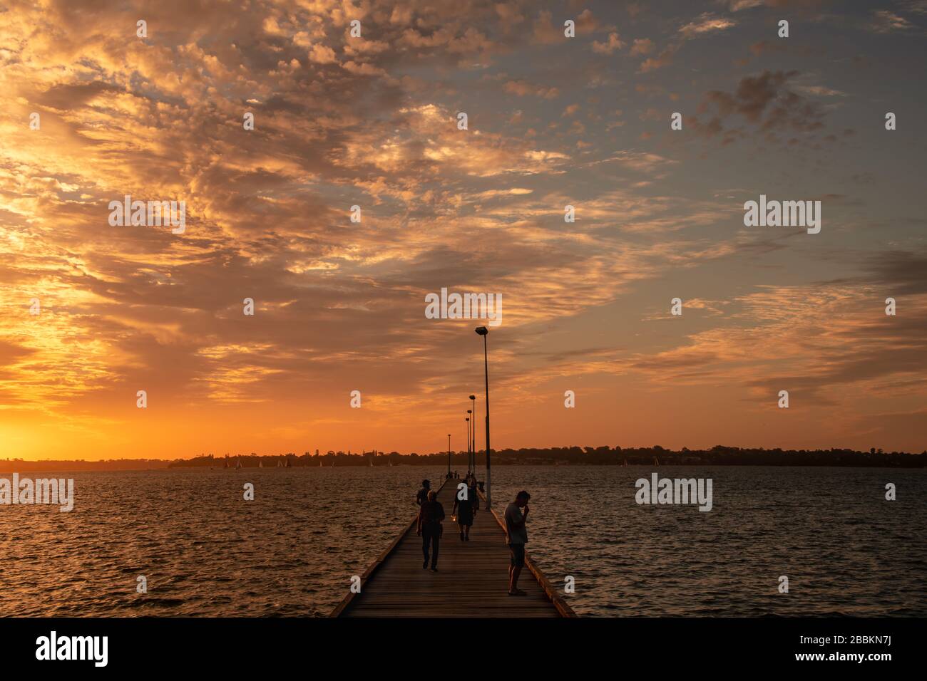 Fiery sunset over Como Jetty, Perth West Australia. Idyllic scene with ...