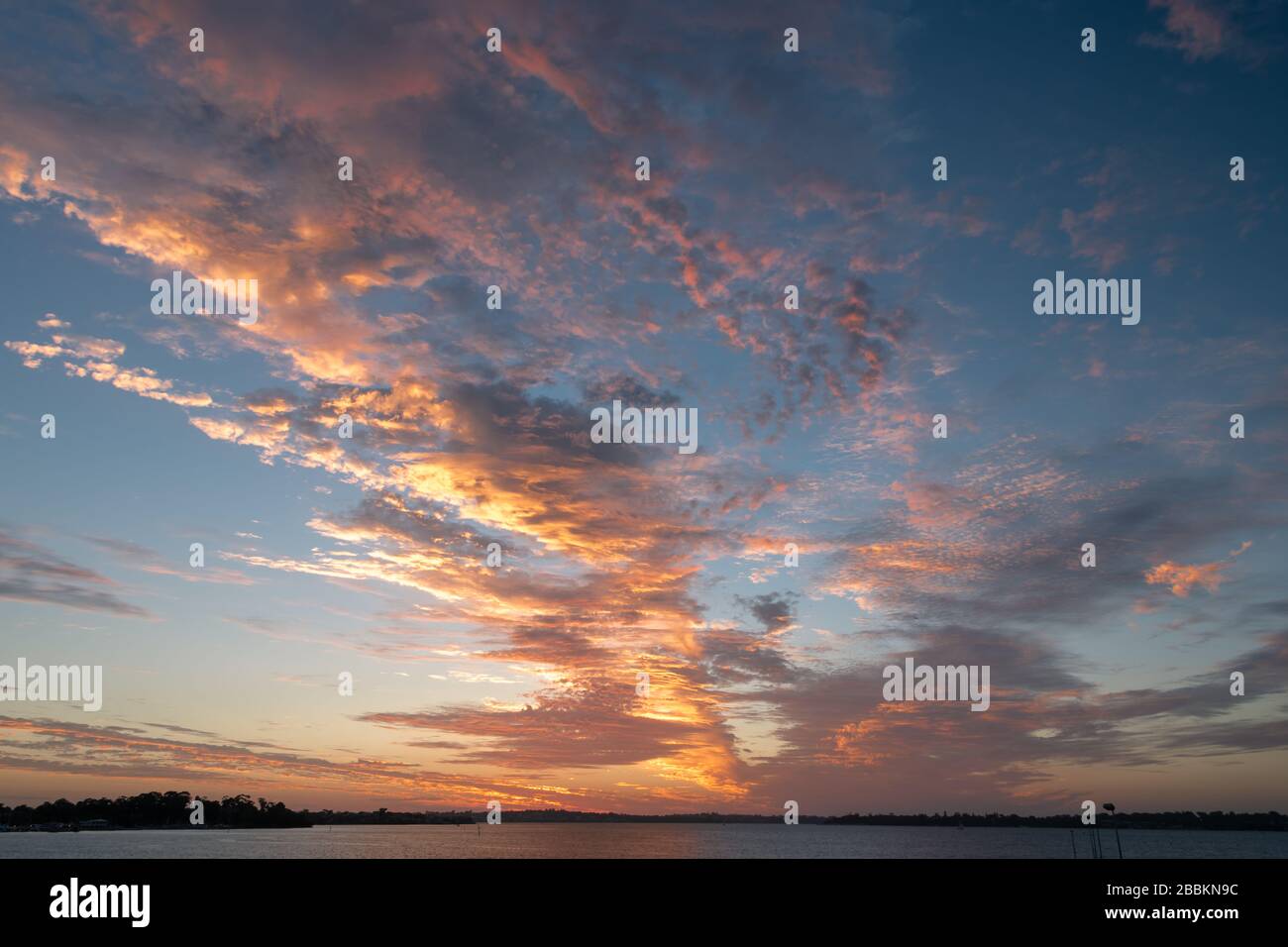 Fiery sunset over the Swan River, Perth West Australia. Idyllic scene ...