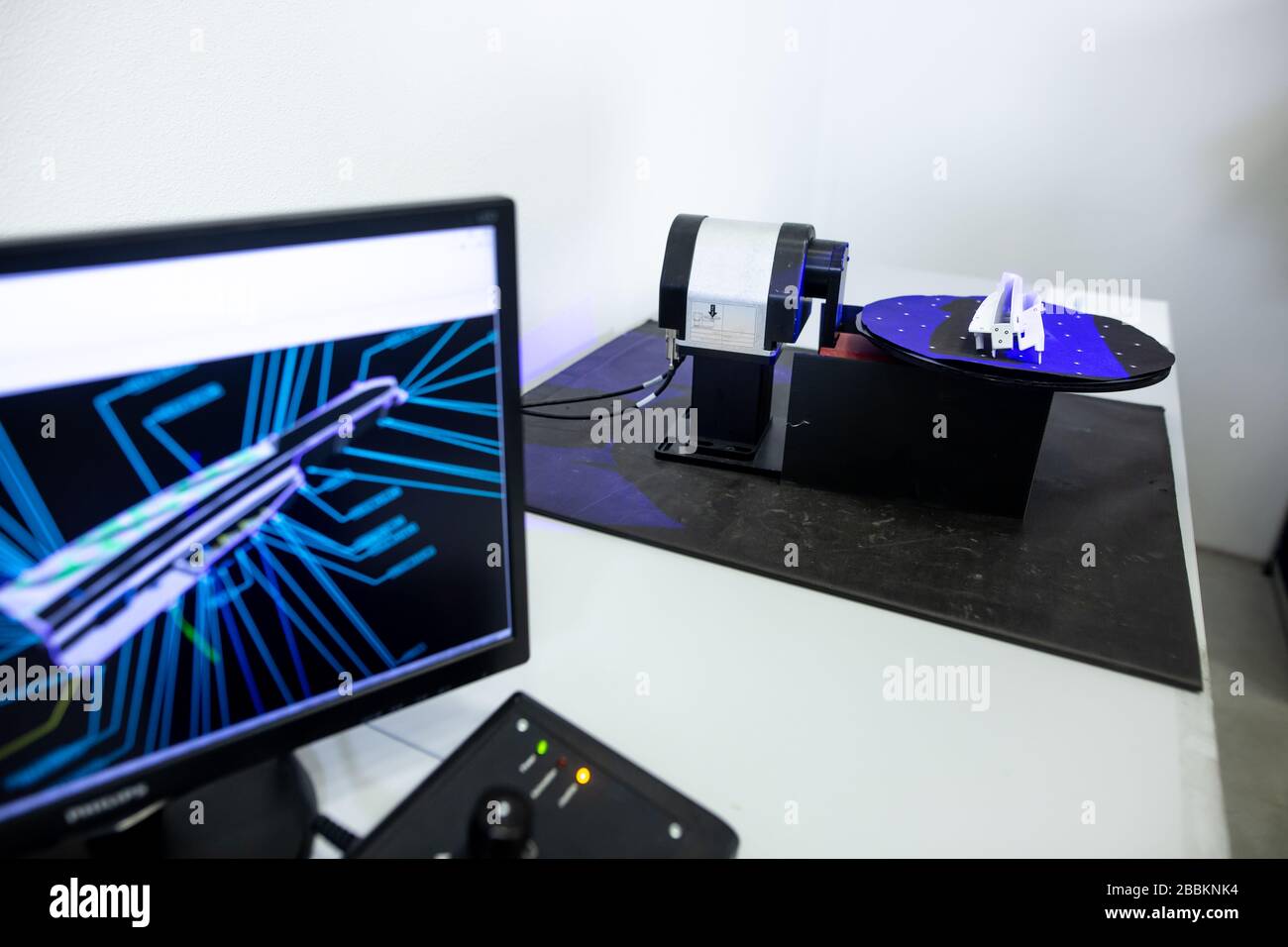 Professional 3D scanner scanning an industrial object, plastic molding ...