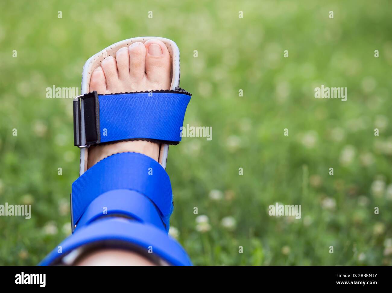 Foot ankle recovery, stabilizing with support brace Stock Photo - Alamy