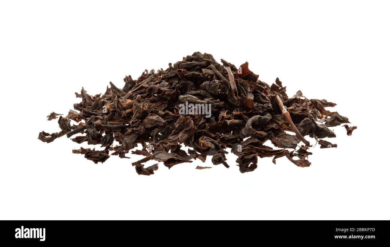 Dry black tea leaves isolated on white background Stock Photo - Alamy