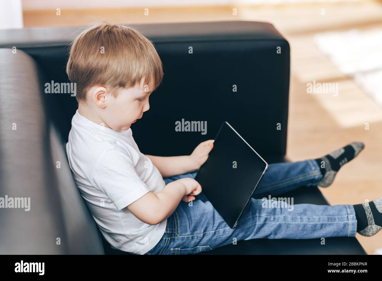 Little boy with a tablet Stock Photo - Alamy