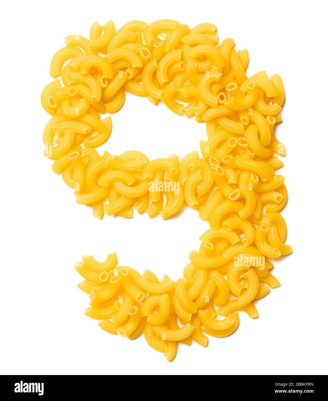 Arabic numeral "9" from dry pasta on a white isolated background. Food ...