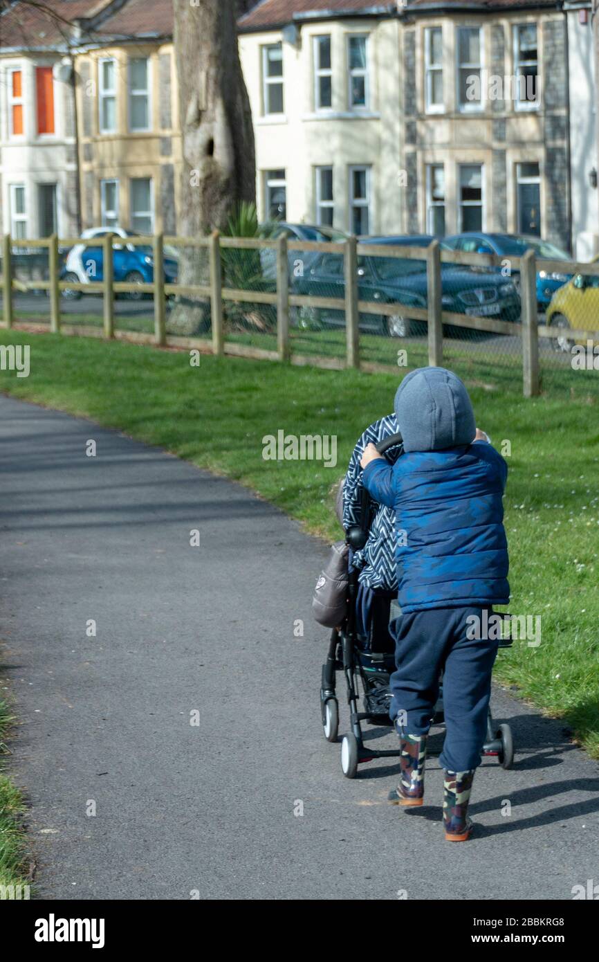 Boy pushing stroller hi-res stock photography and images - Alamy