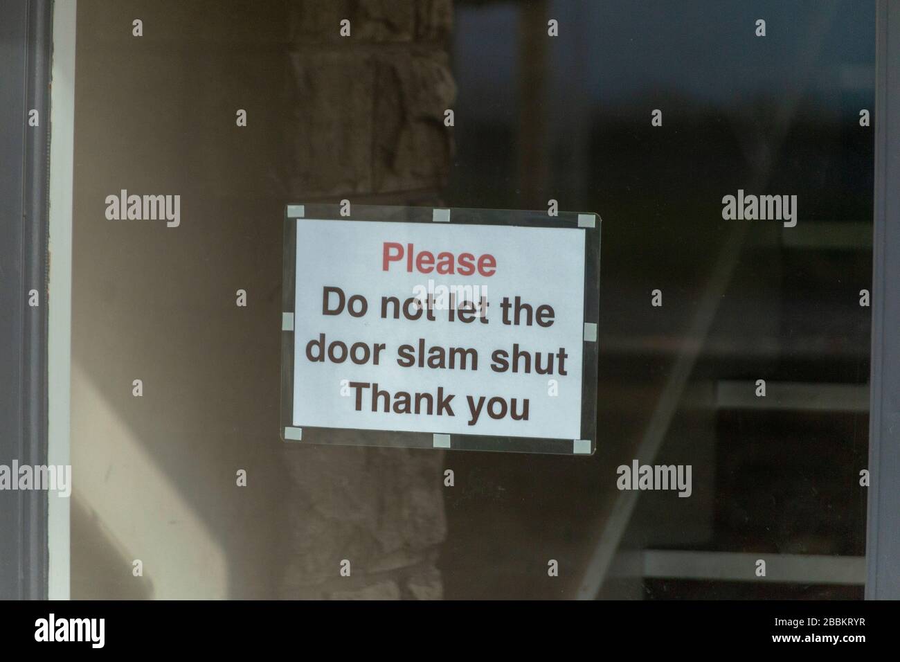 a close up view of a warning sign that has been placed on the glass ...