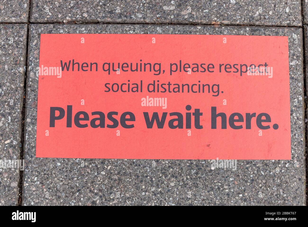 A close up view of taped off area on where to stand waiting to get into ...