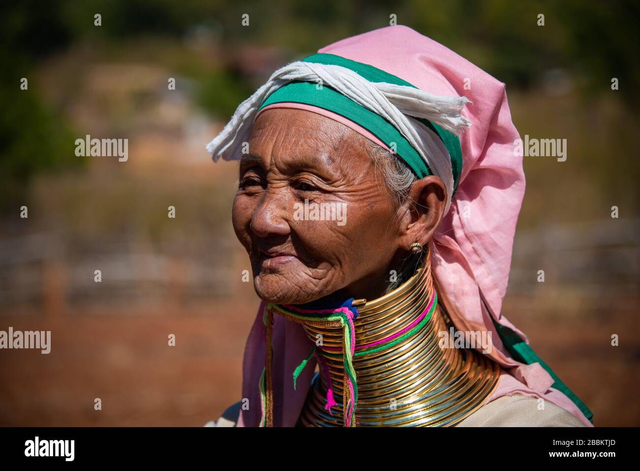 Pan Pet, Kayah State, Myanmar - February 2020: Portrait of an elderly Kayan longneck woman or ...