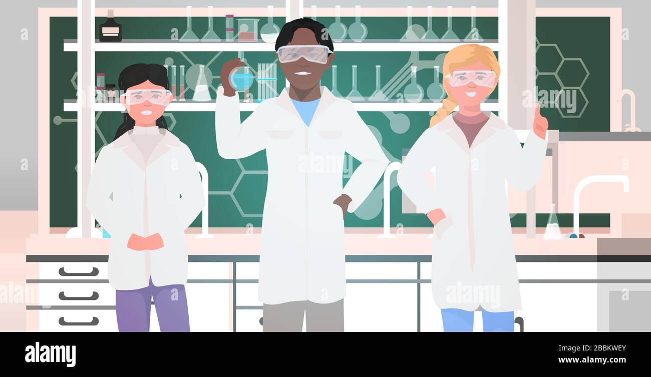 mix race pupils in uniform holding test tubes working in chemical ...