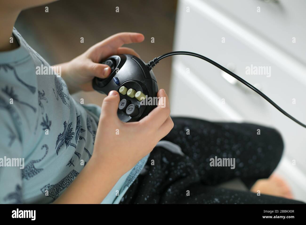 Boy playing video games at home. Family staying at home. Self isolation ...