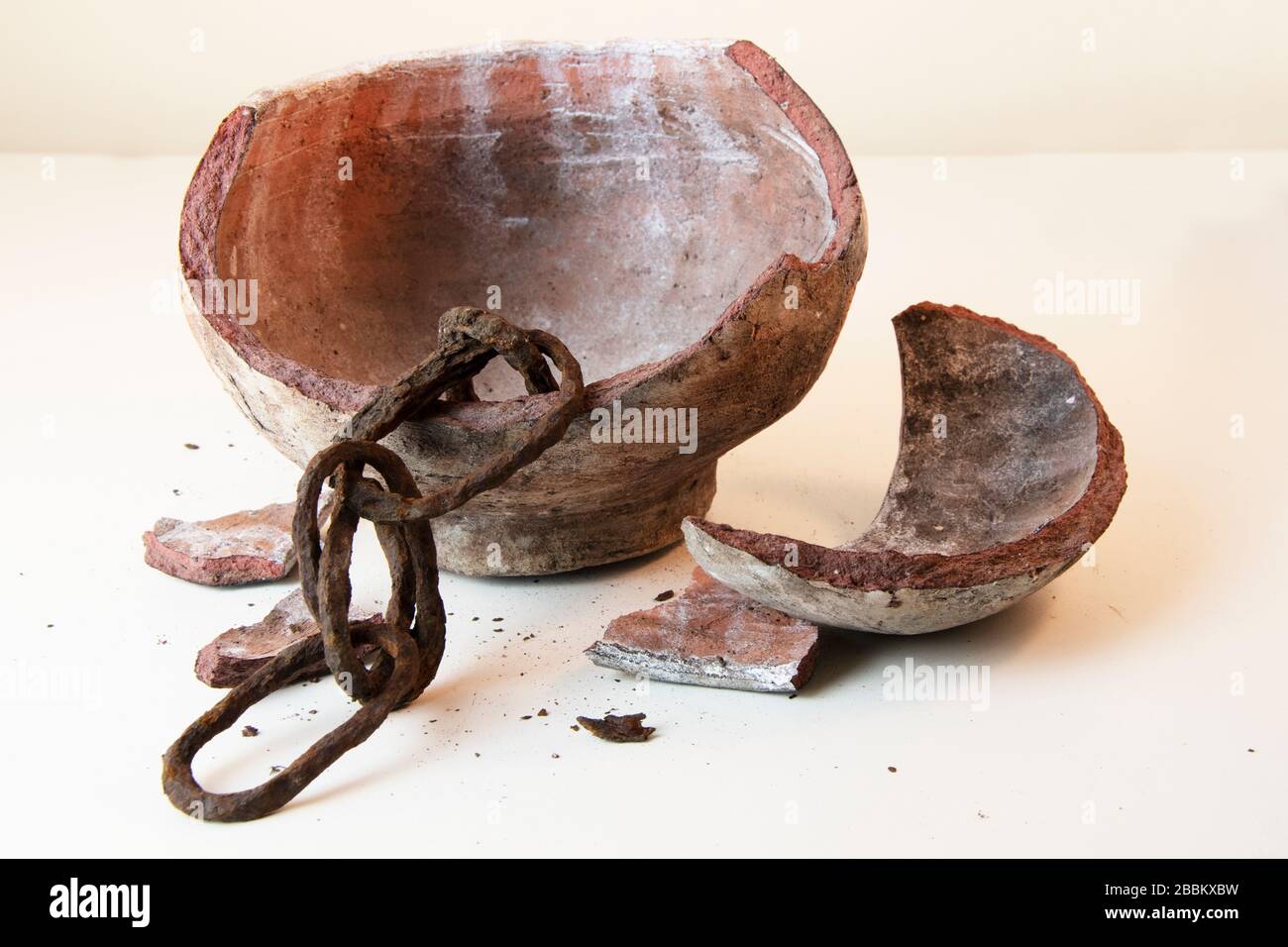 Old rustic chain inside broken clay pot Stock Photo - Alamy
