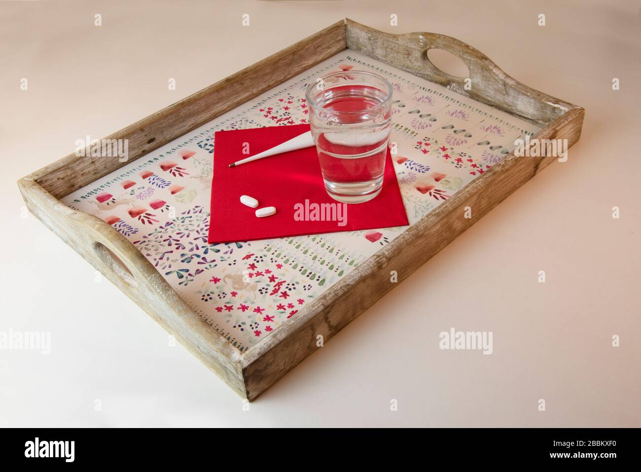 Tray with water glass, pills and thermometer, red and white Stock Photo ...