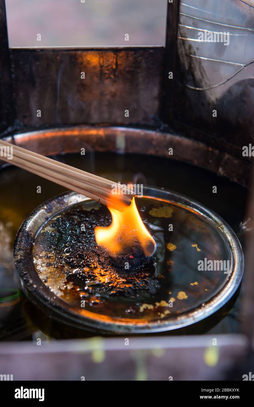 Red incense hi-res stock photography and images - Alamy
