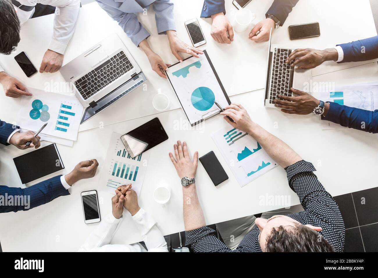 Team hands together documents hi-res stock photography and images - Alamy
