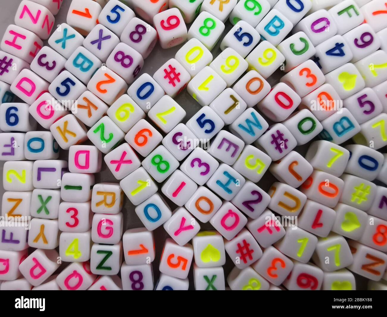 Set of plastic cubes with colored letters and numbers Stock Photo - Alamy