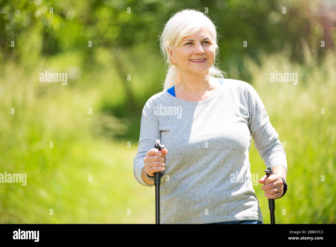 Woman walking in a park hi-res stock photography and images - Alamy