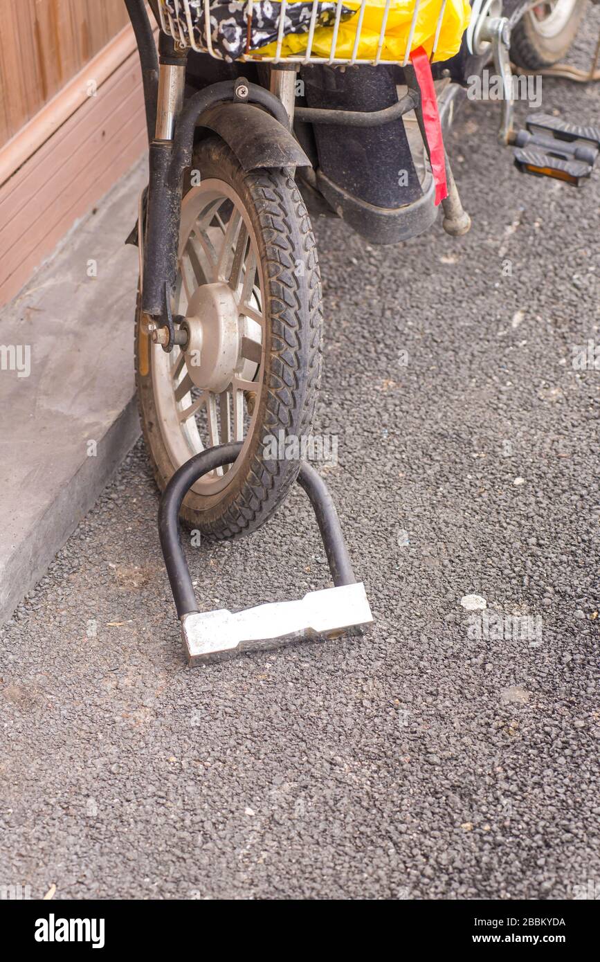 Master key for locking the motorcycle wheel on street Stock Photo - Alamy