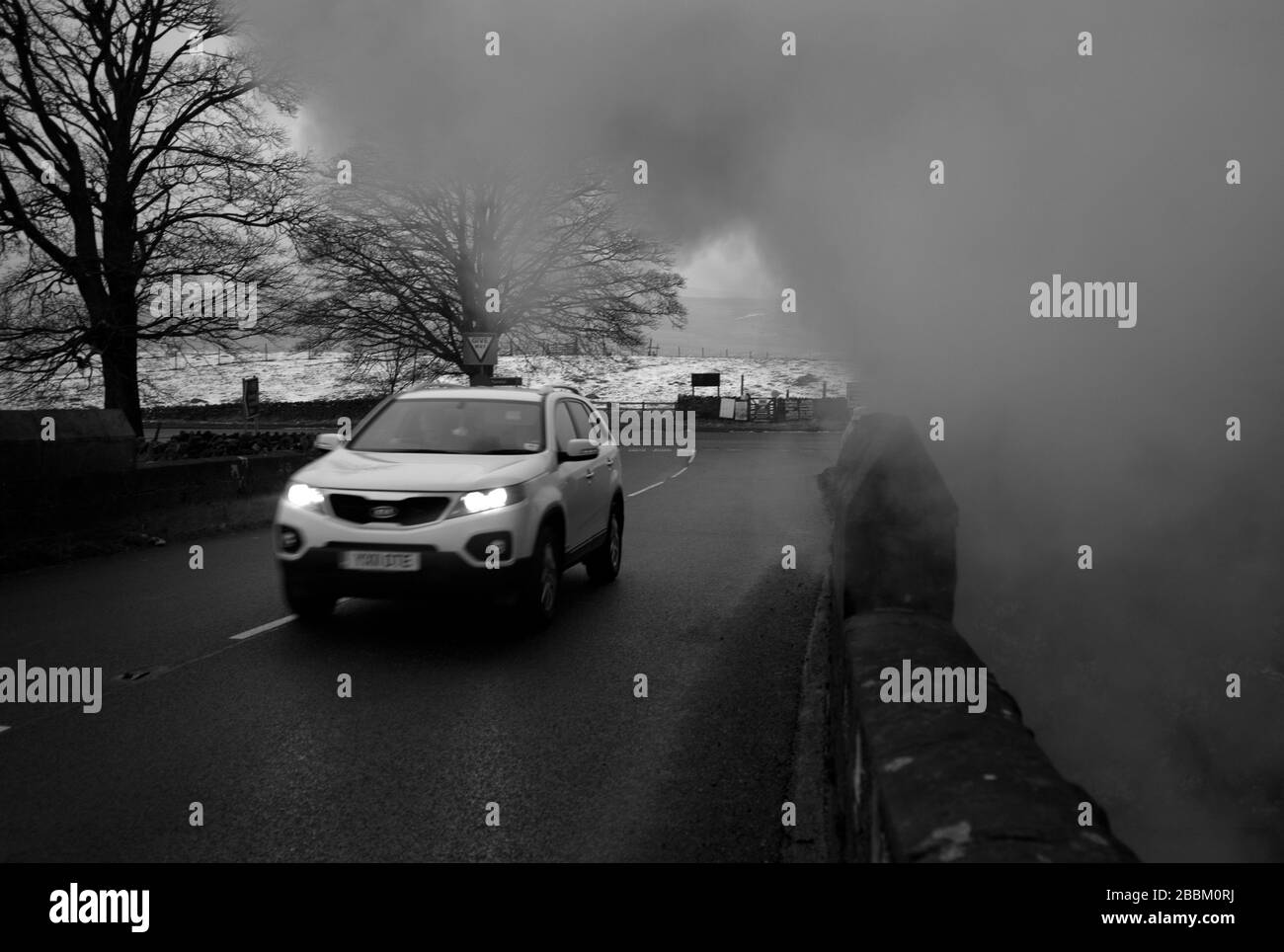 White car headlights on Black and White Stock Photos & Images - Alamy