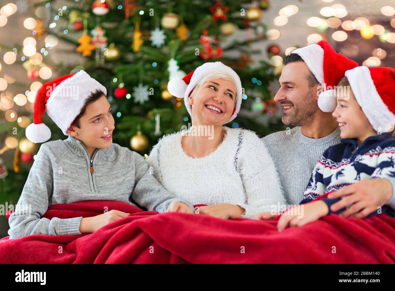 Smiling family at Christmas time Stock Photo - Alamy