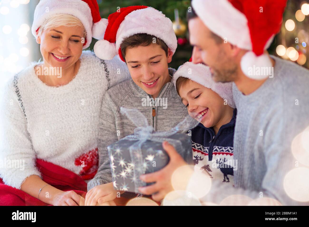 Smiling family at Christmas time Stock Photo - Alamy