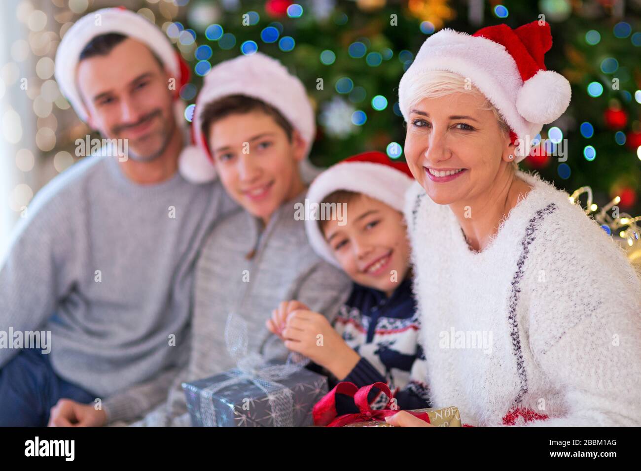 Smiling family at Christmas time Stock Photo - Alamy