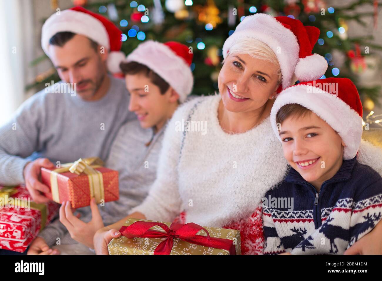 Smiling family at Christmas time Stock Photo - Alamy