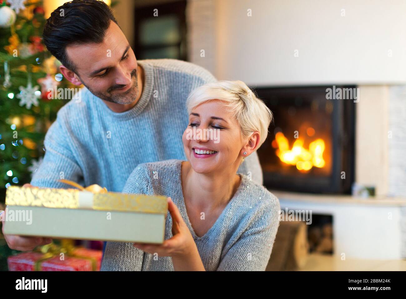 Couple together on Christmas Stock Photo - Alamy