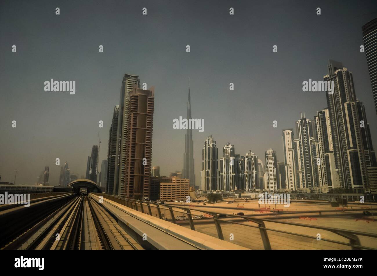 the Dubai Metro, MRT, in motion along Sheikh Zayed road with the ...