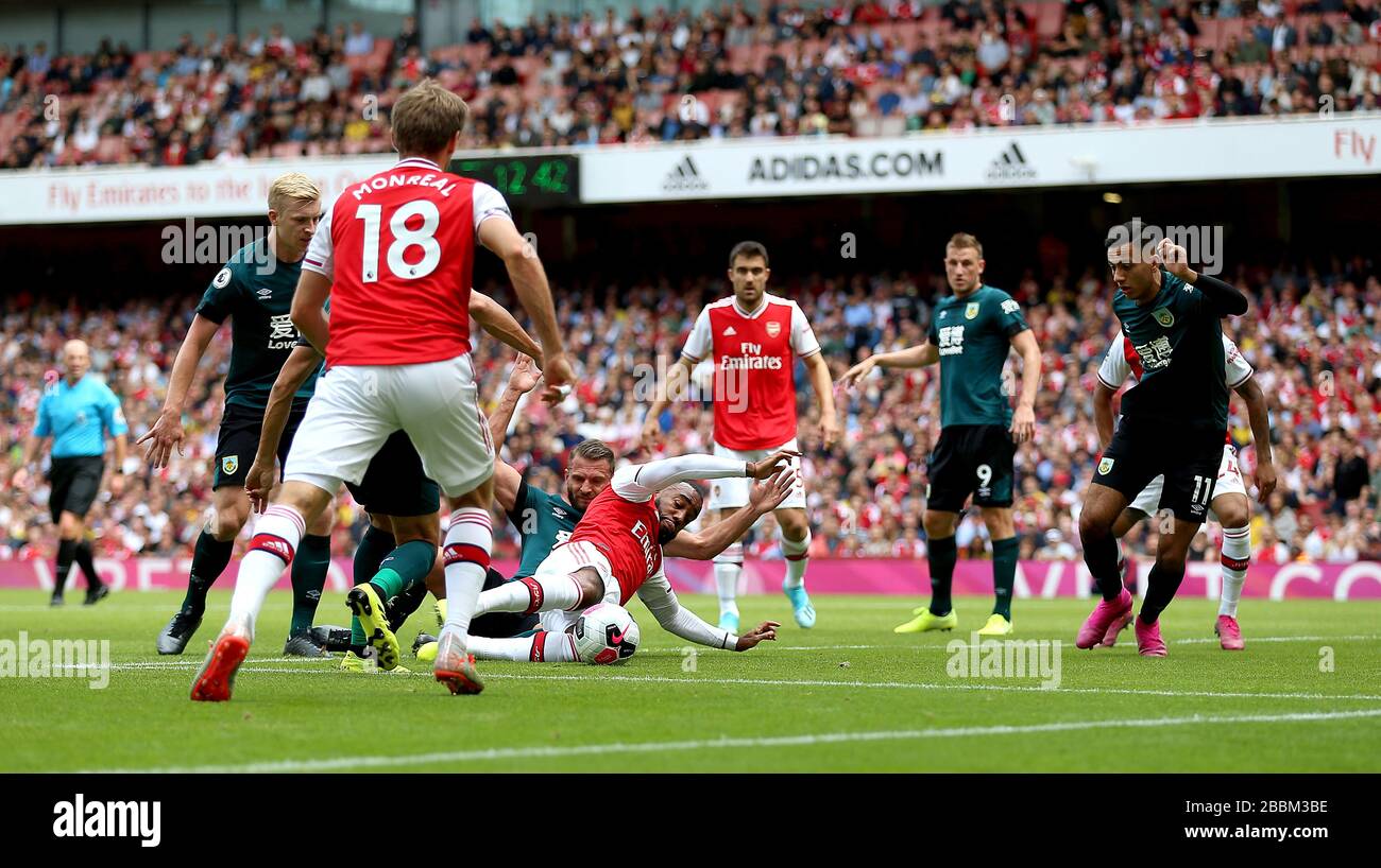 Arsenal's Alexandre Lacazette (centre) scores his side's first goal of ...