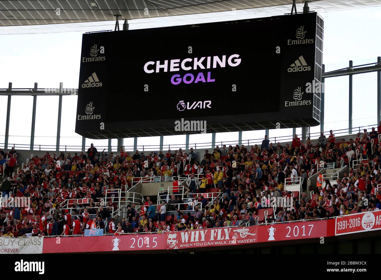 The big screen shows the VAR checking to confirm that Arsenal's Reiss ...