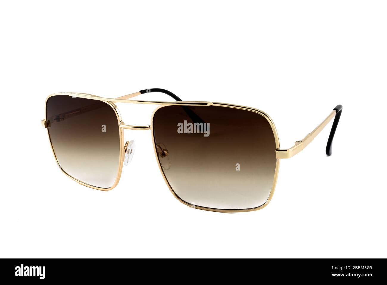 Brown pilot aviator sunglasses with gold rimmed isolated white ...