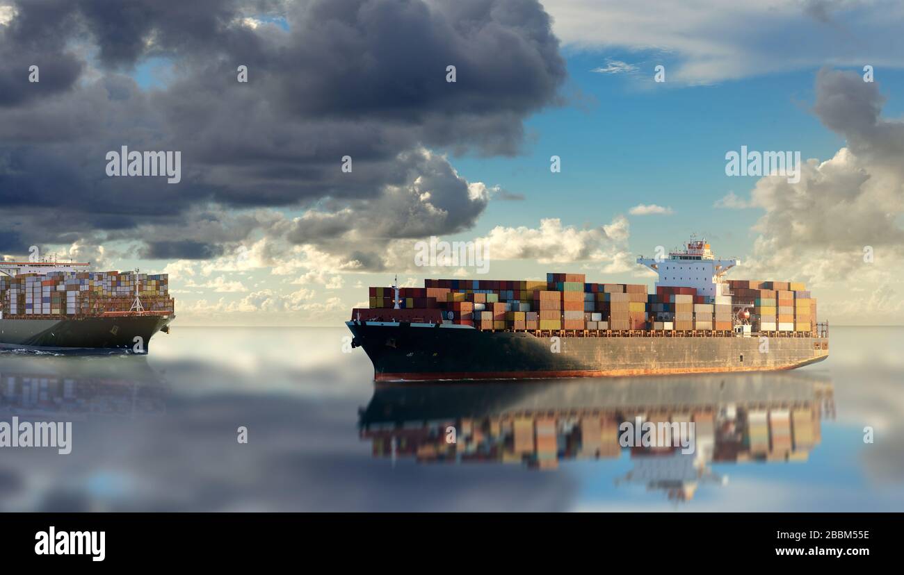 Mighty container ships in ocean at sunrise underway performing import and export marine cargo ...