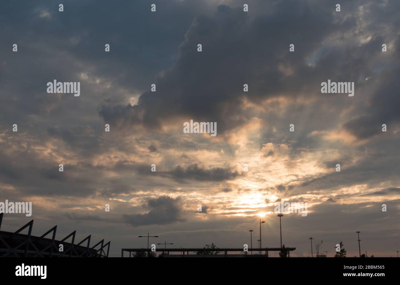 Dark sky heavy and rainy clouds with sun. Sky background Stock Photo ...