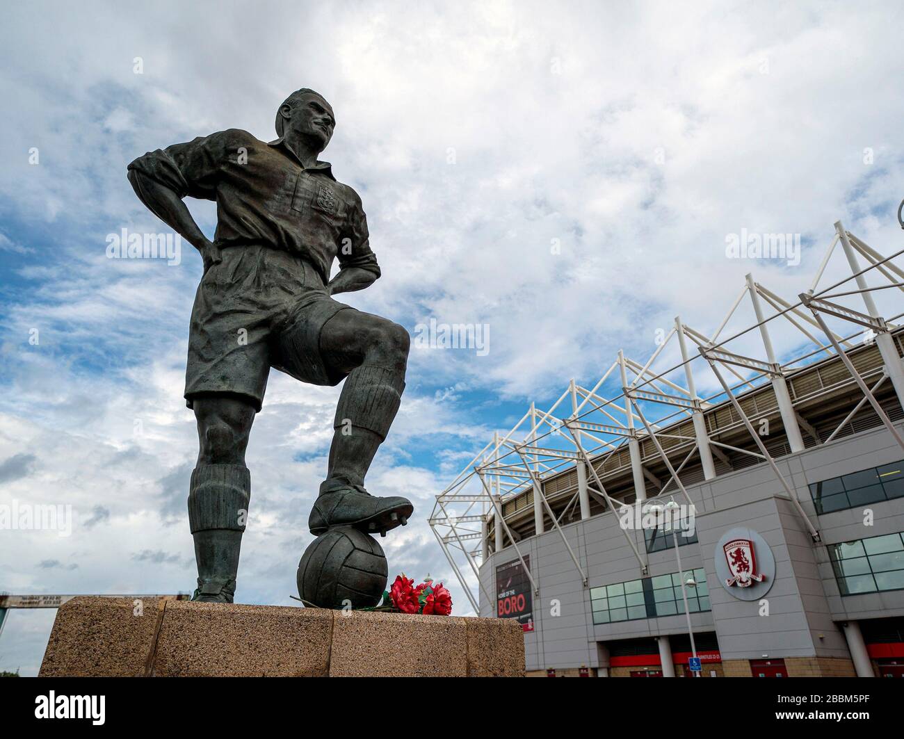 George Harwick statue at the gates to the stadium before game between ...