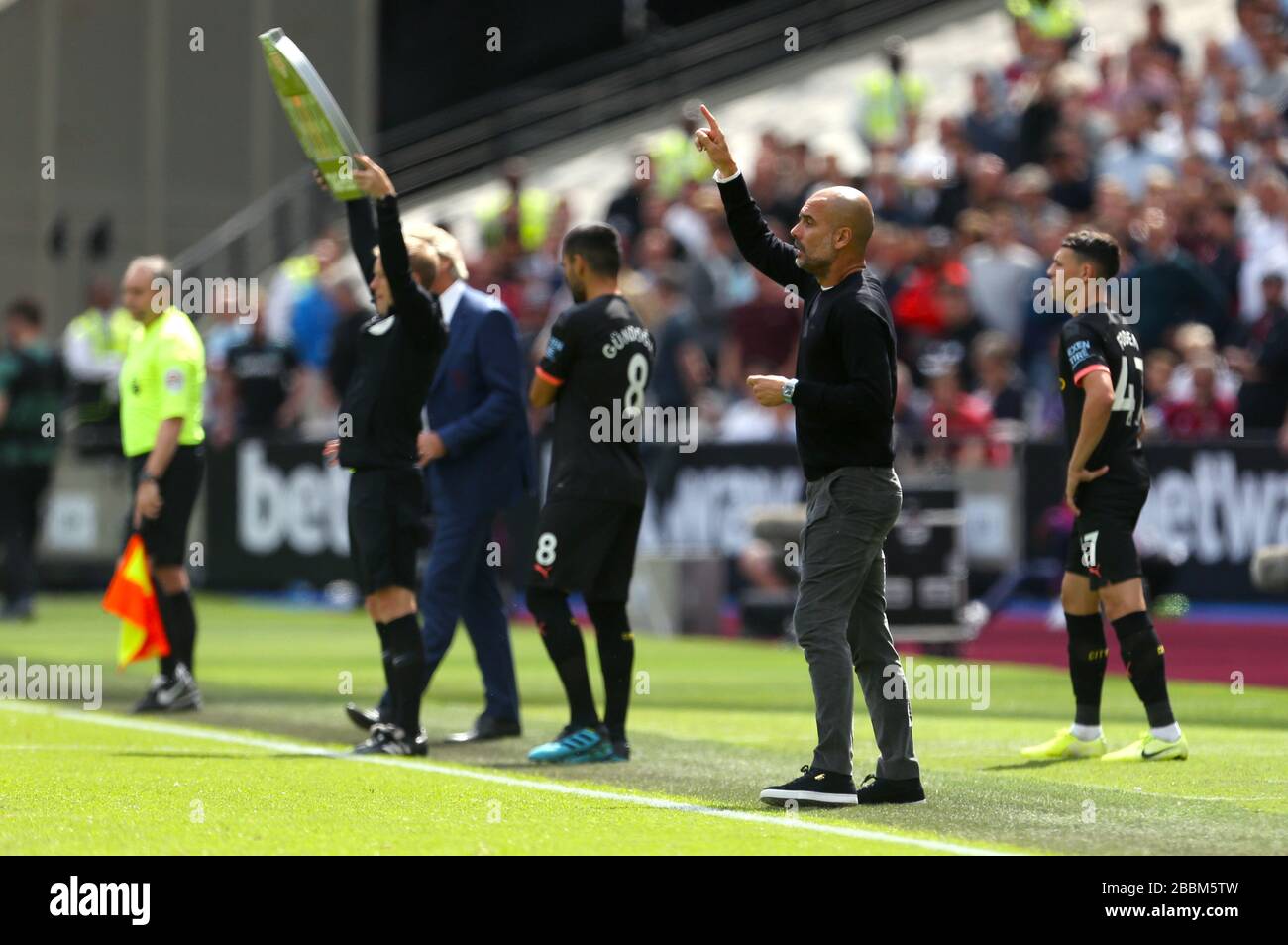Manchester City manager Pep Guardiola gestures on the touchline Stock ...