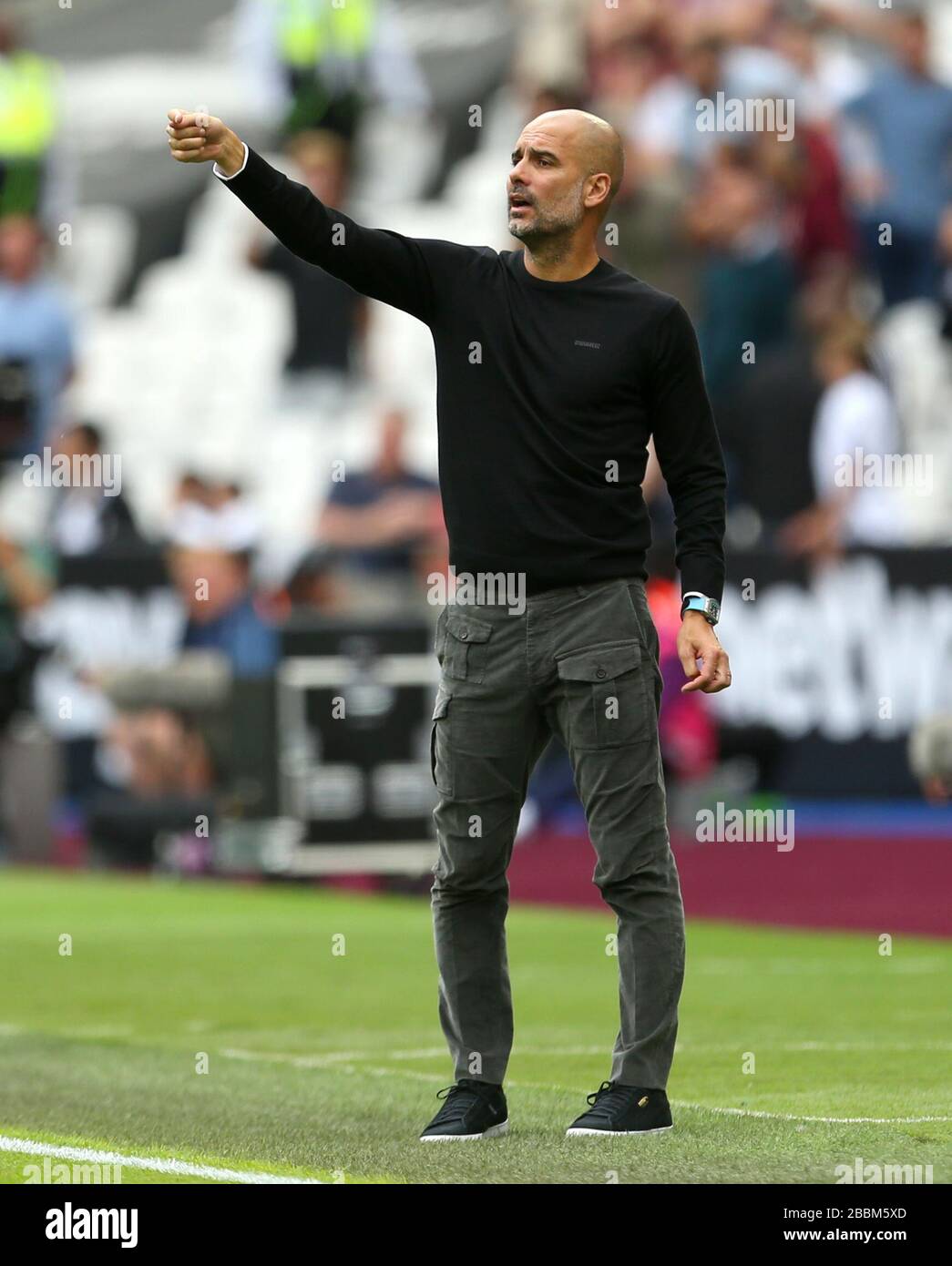 Manchester City manager Pep Guardiola gestures on the touchline Stock ...