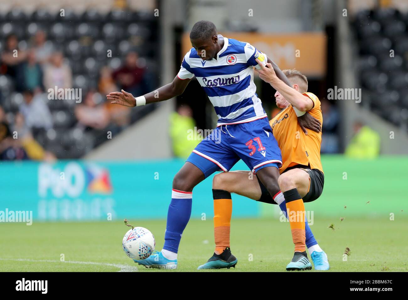 Reading's Lucas Joao and Hull City's Reece Burke battle for the ball ...