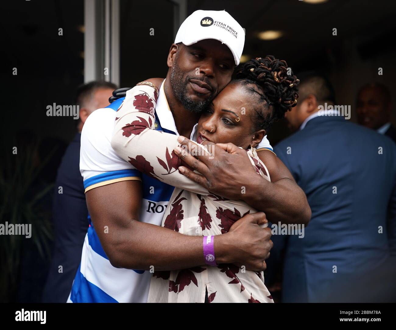 Kiyan Prince's father Mark and his wife share an embrace after the ...