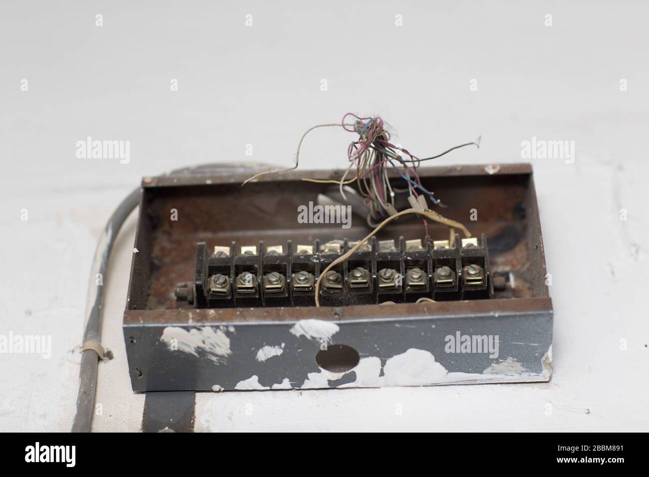 Old electrical distribution box on white wall Stock Photo - Alamy