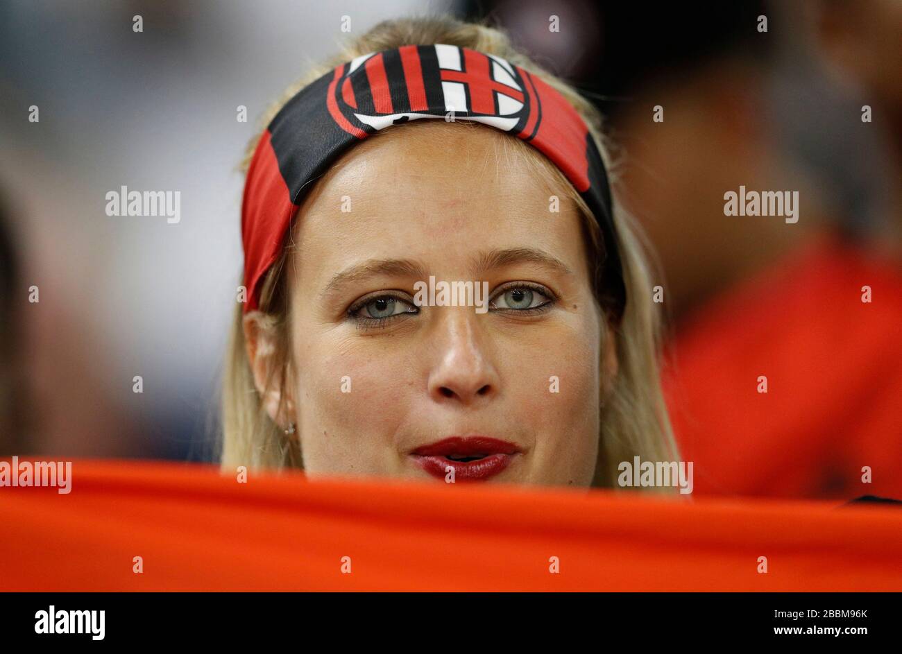 An AC Milan fan before their game against Manchester United Stock Photo ...