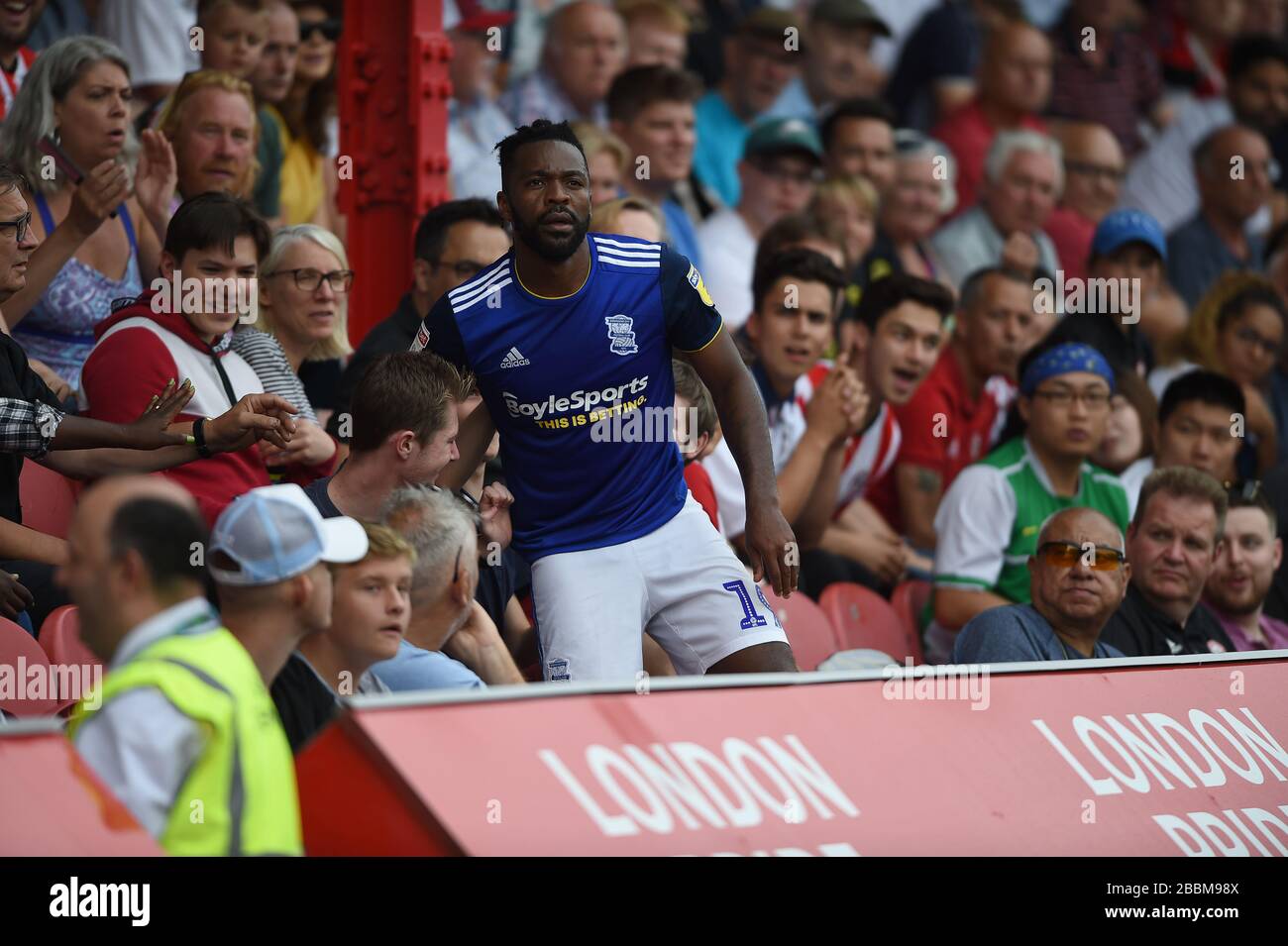 Birmingham City's Kerim Mrabti is forced into the crowd by a shoulder ...