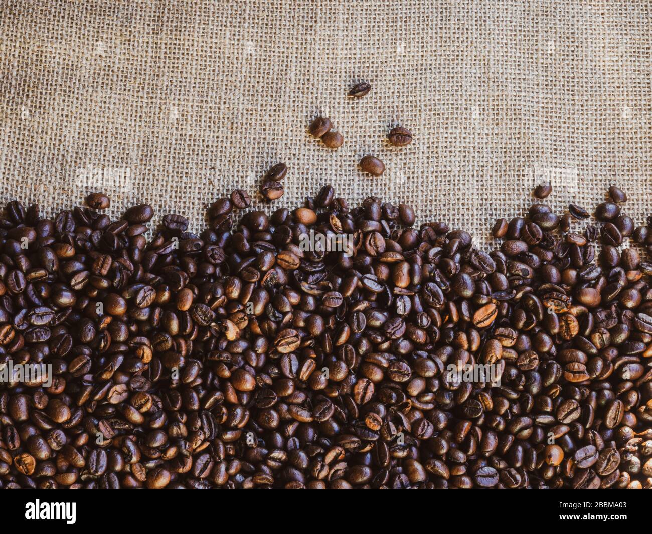 Top view angle of roasted coffee beans on table Stock Photo - Alamy
